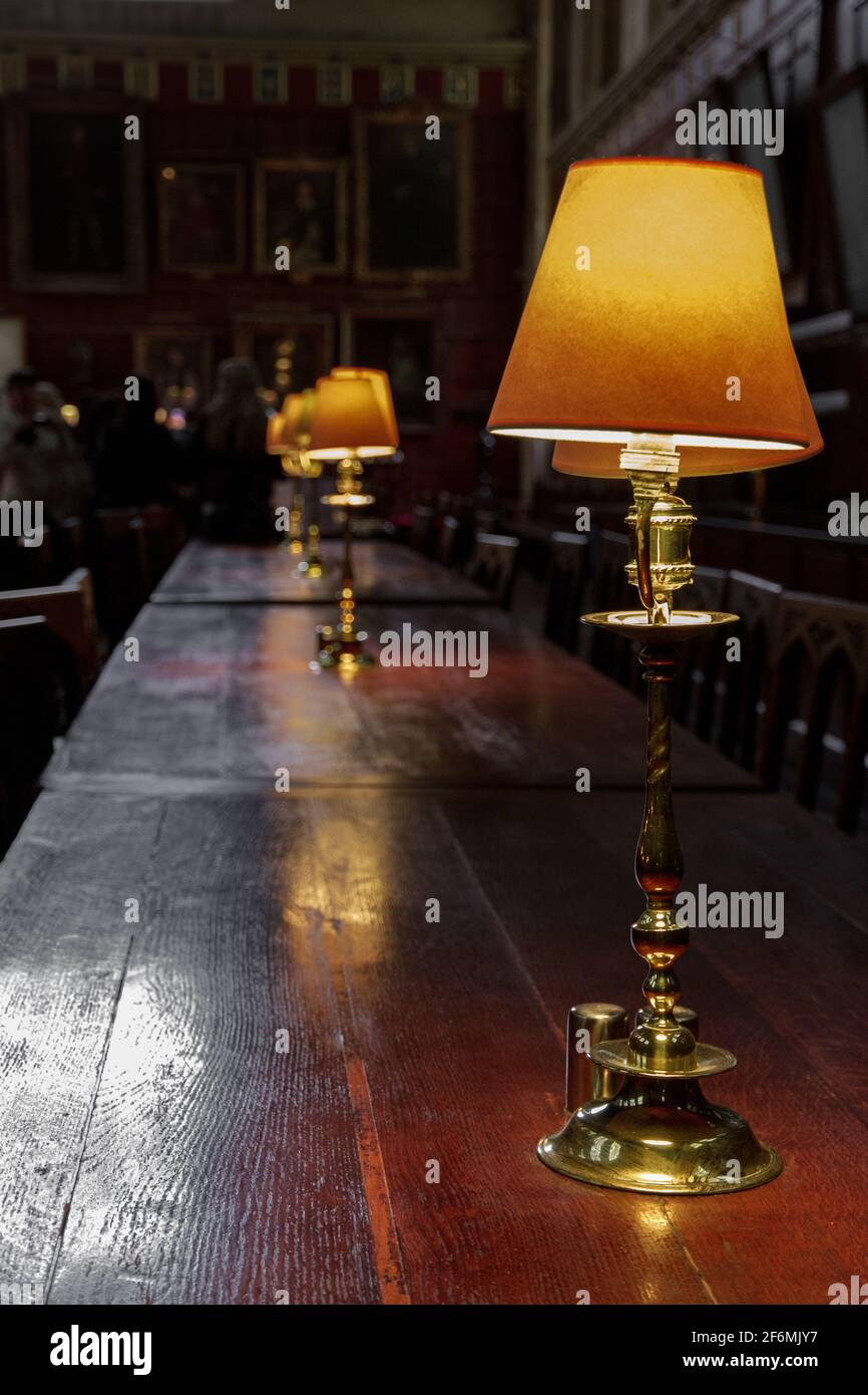 Line of orange lamps standing on the tables Christ Church College Hall ...