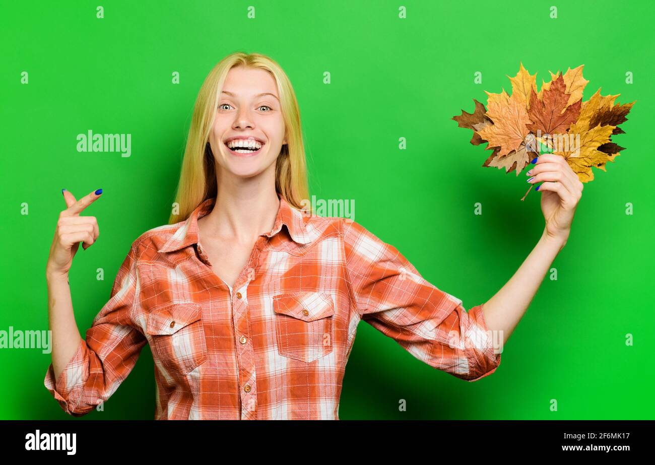 Autumn girl. Happy girl playing with leaves. Smiling woman having fun ...