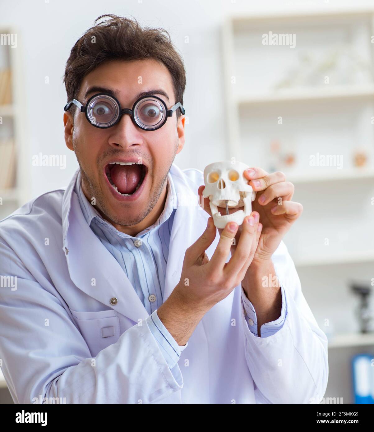 The crazy doctor studying human skeleton Stock Photo - Alamy