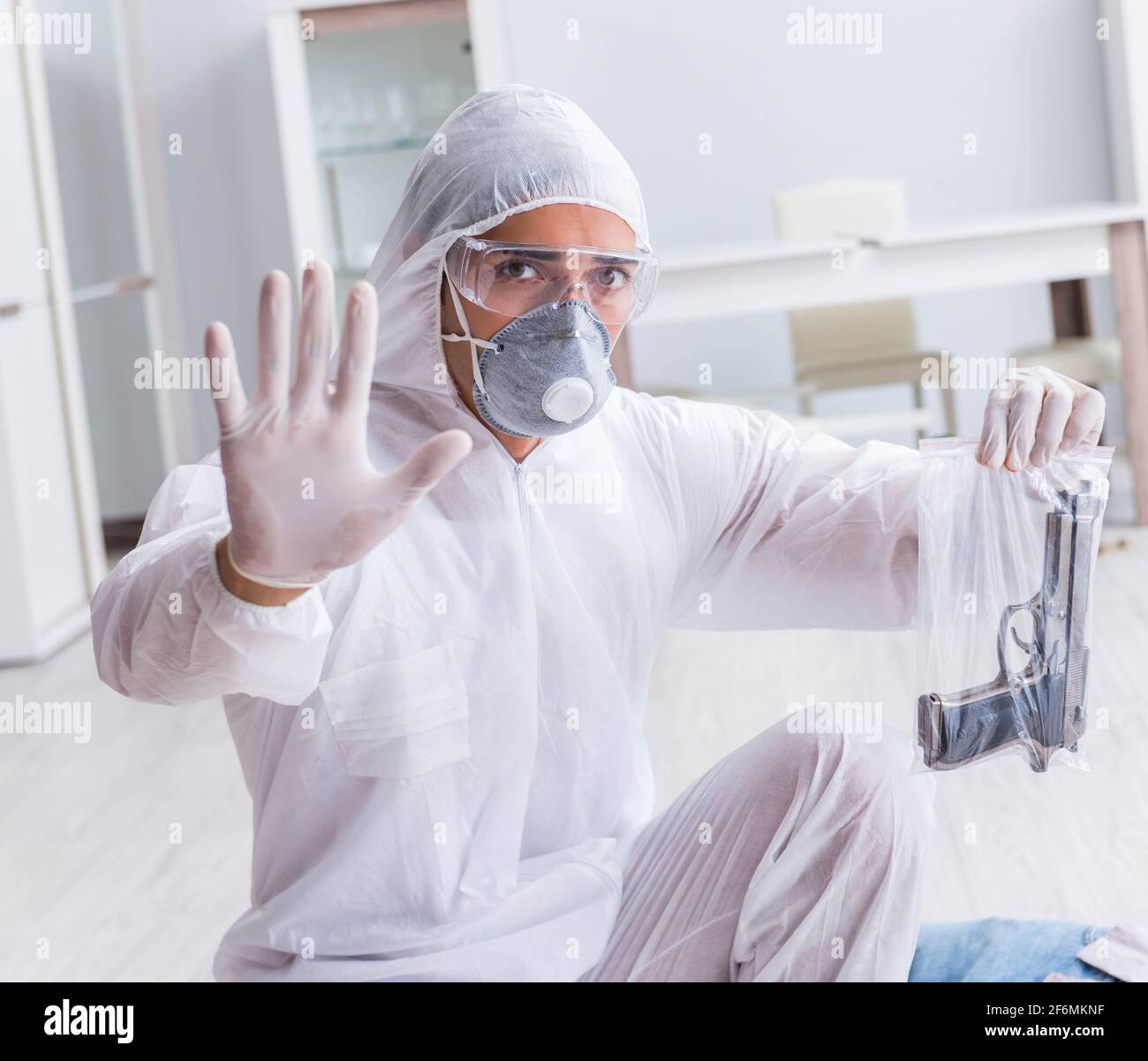 Forensic investigator at the crime scene investigating woman murder ...