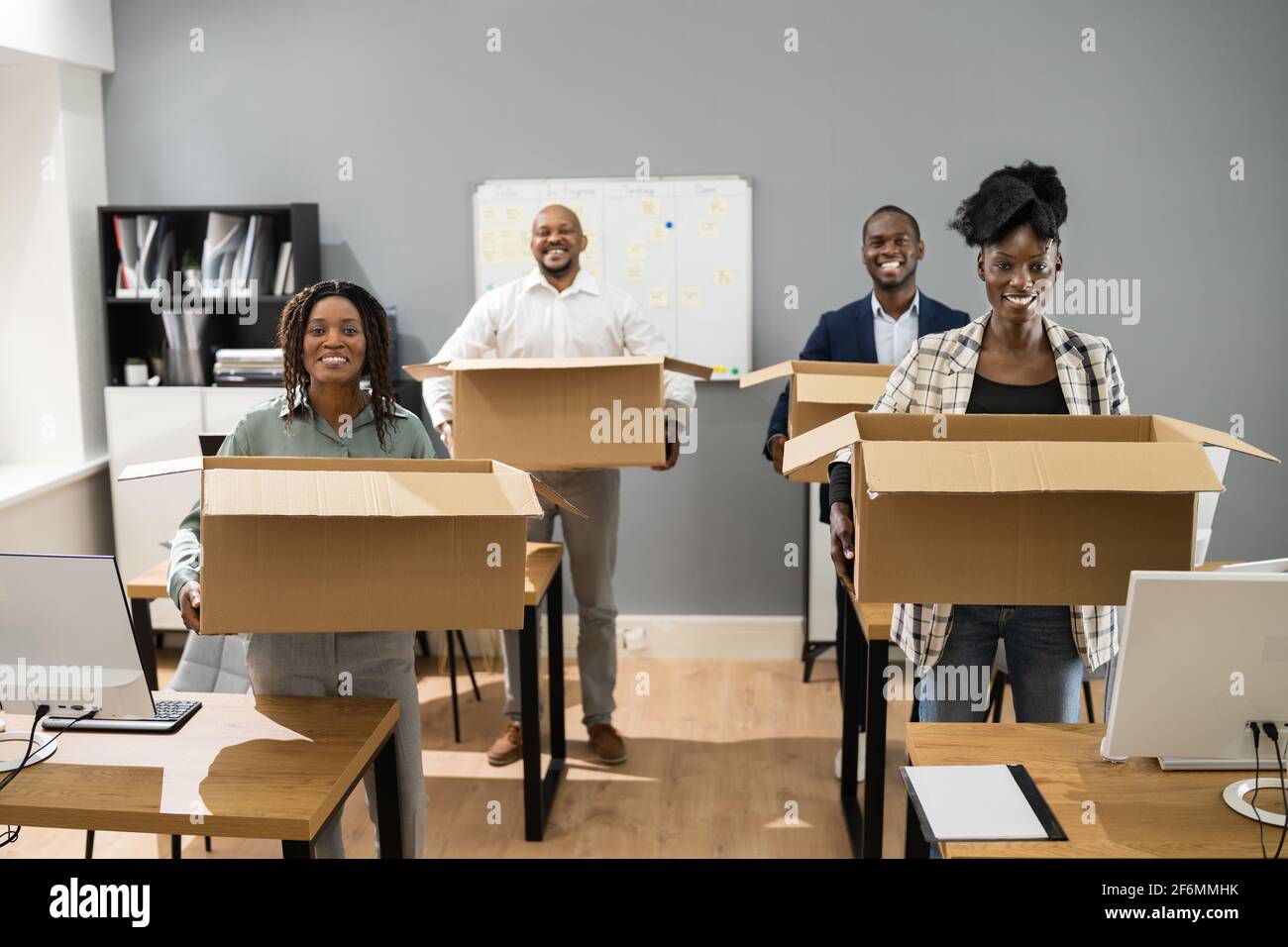 African Corporate Group Of People Or Team Moving Stock Photo - Alamy