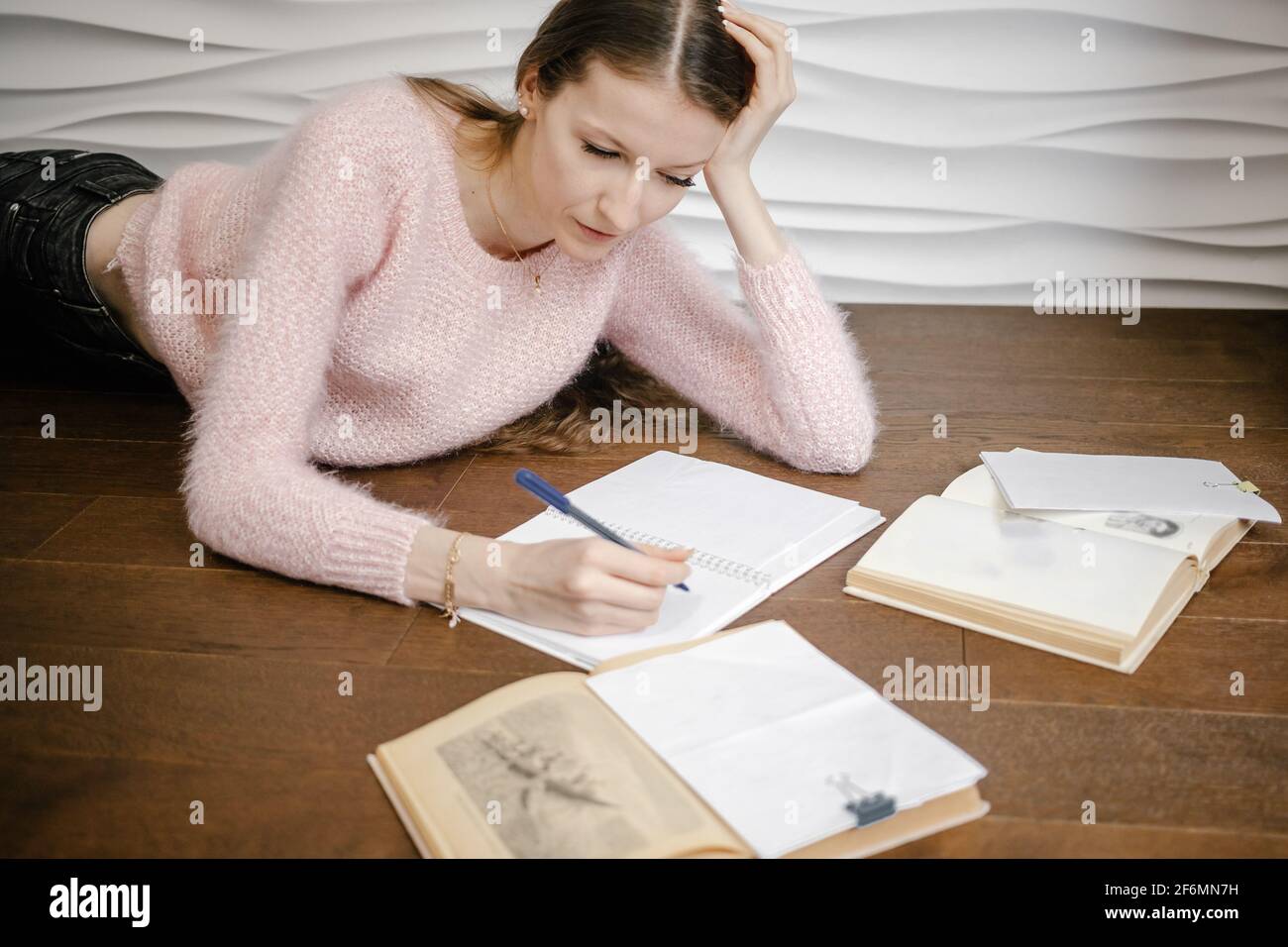 Happy beautiful girl school college student sit on floor, reading a ...