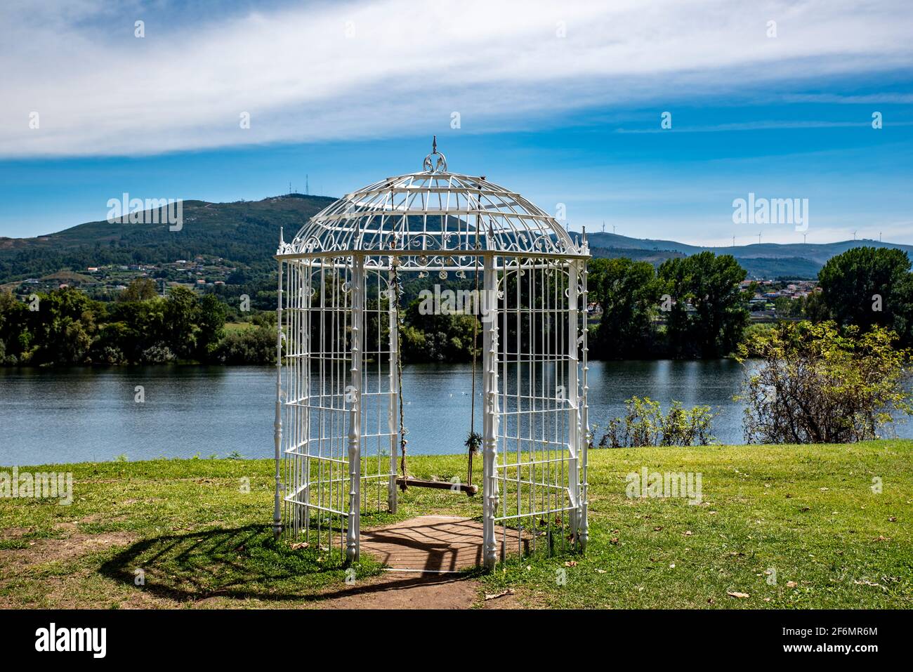 beautiful swing on the banks of the river Miño as it passes through the ...