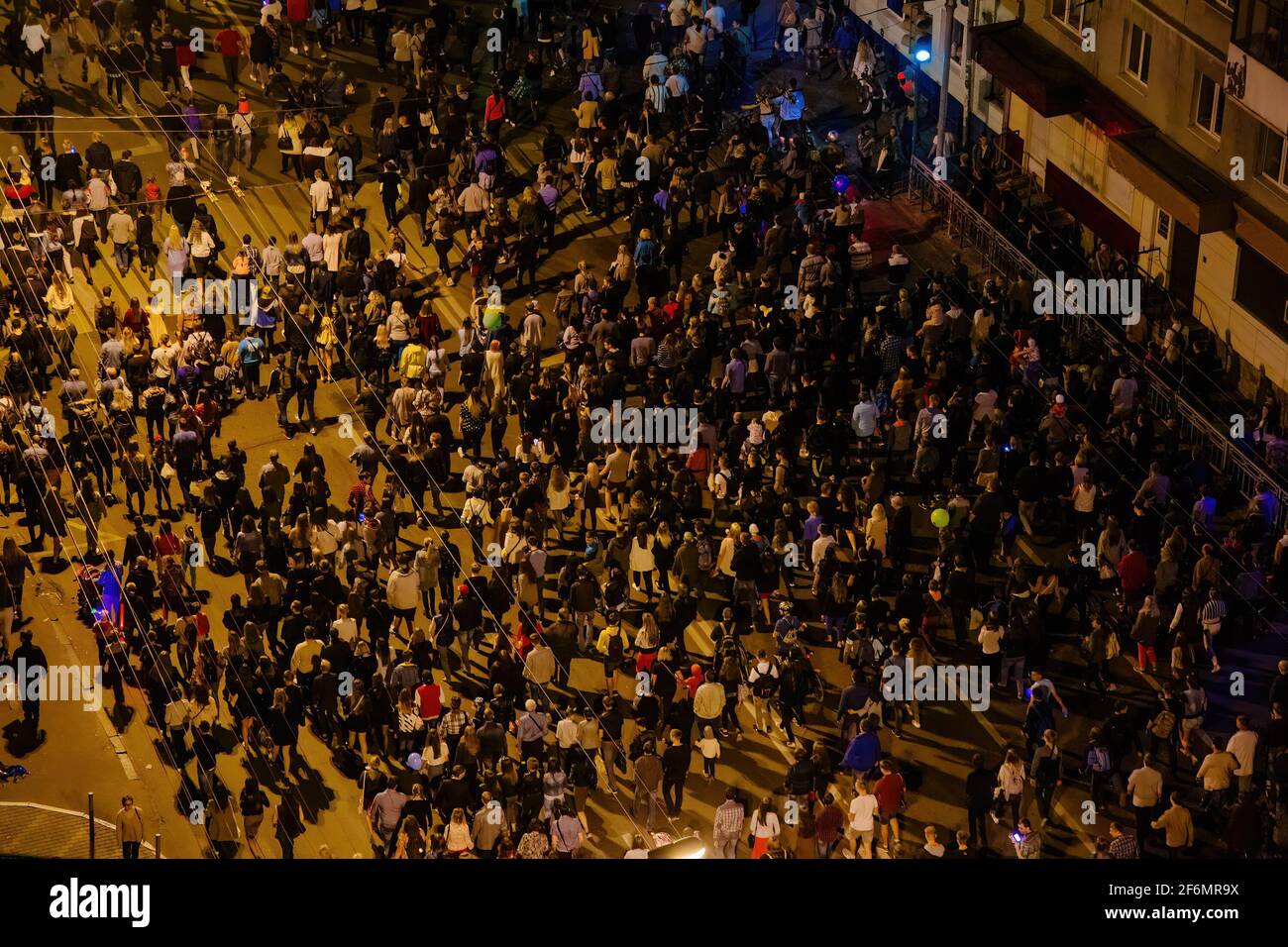 Aerial view of crowd of people walking along the street Stock Photo - Alamy