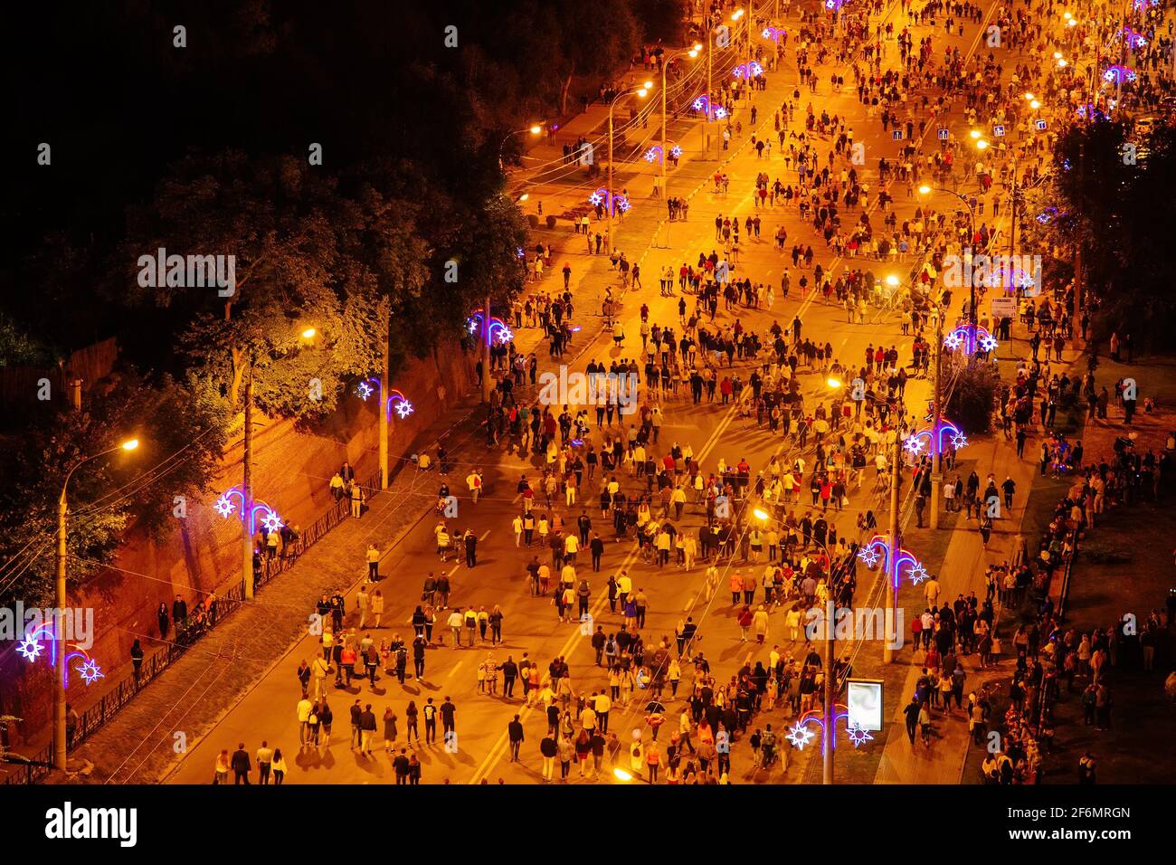 Aerial view of crowd of people walking along the street Stock Photo - Alamy