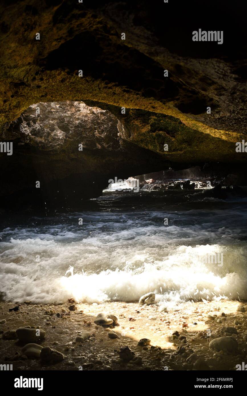 Spectacular Mermaid Caves with sunlight piercing through hole in ...