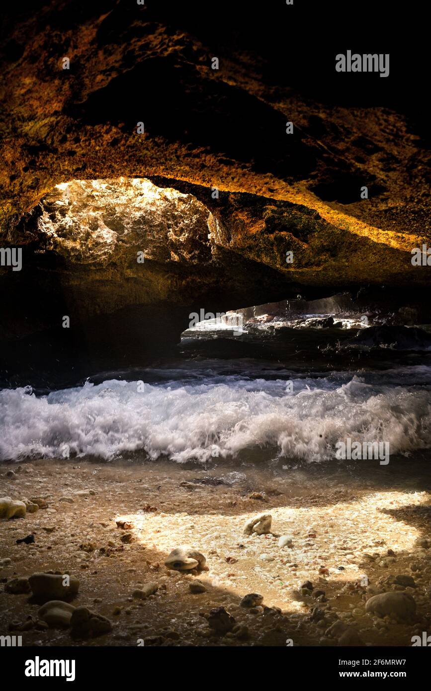 Spectacular Mermaid Caves with sunlight piercing through hole in ...