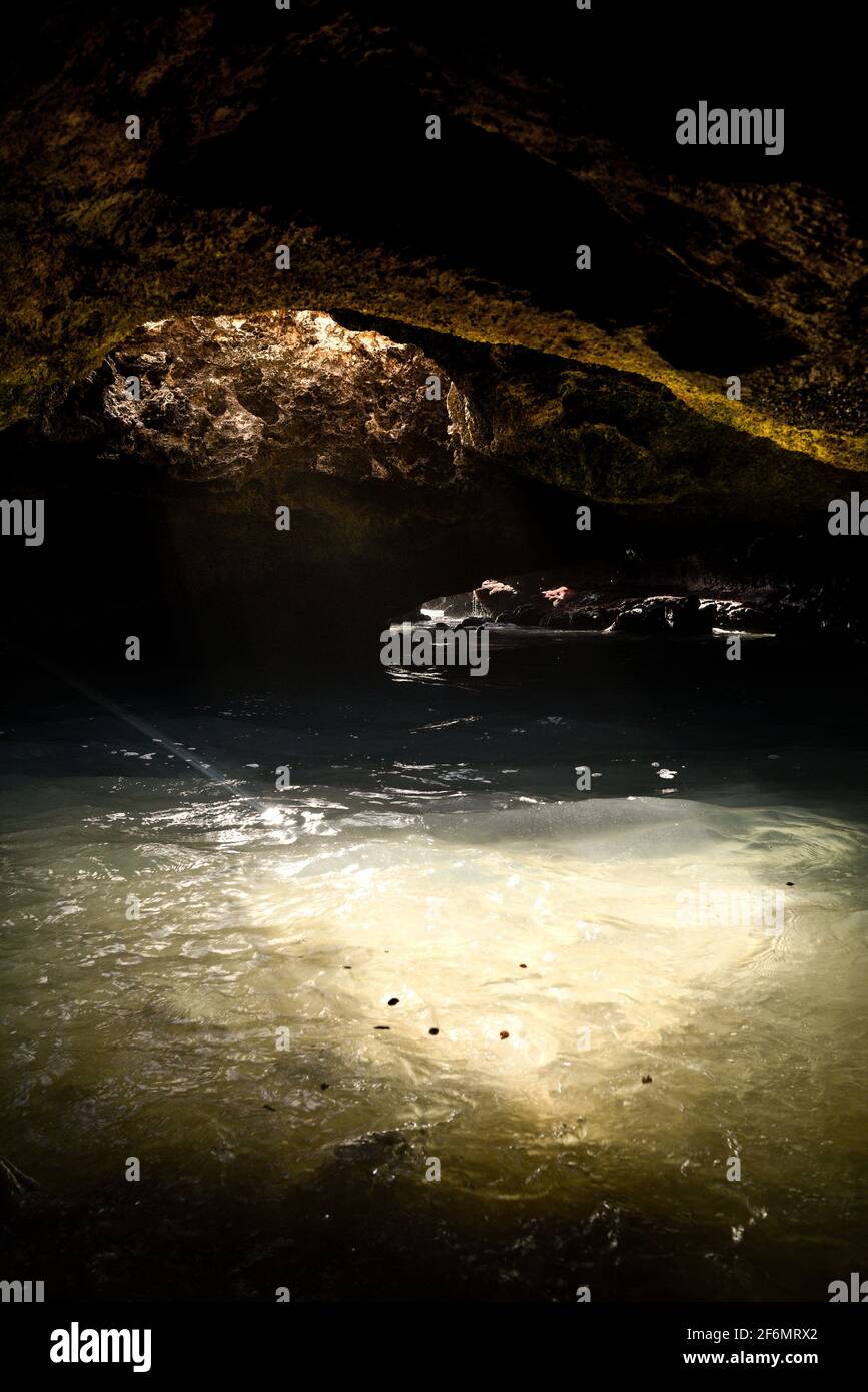 Spectacular Mermaid Caves with sunlight piercing through hole in ...