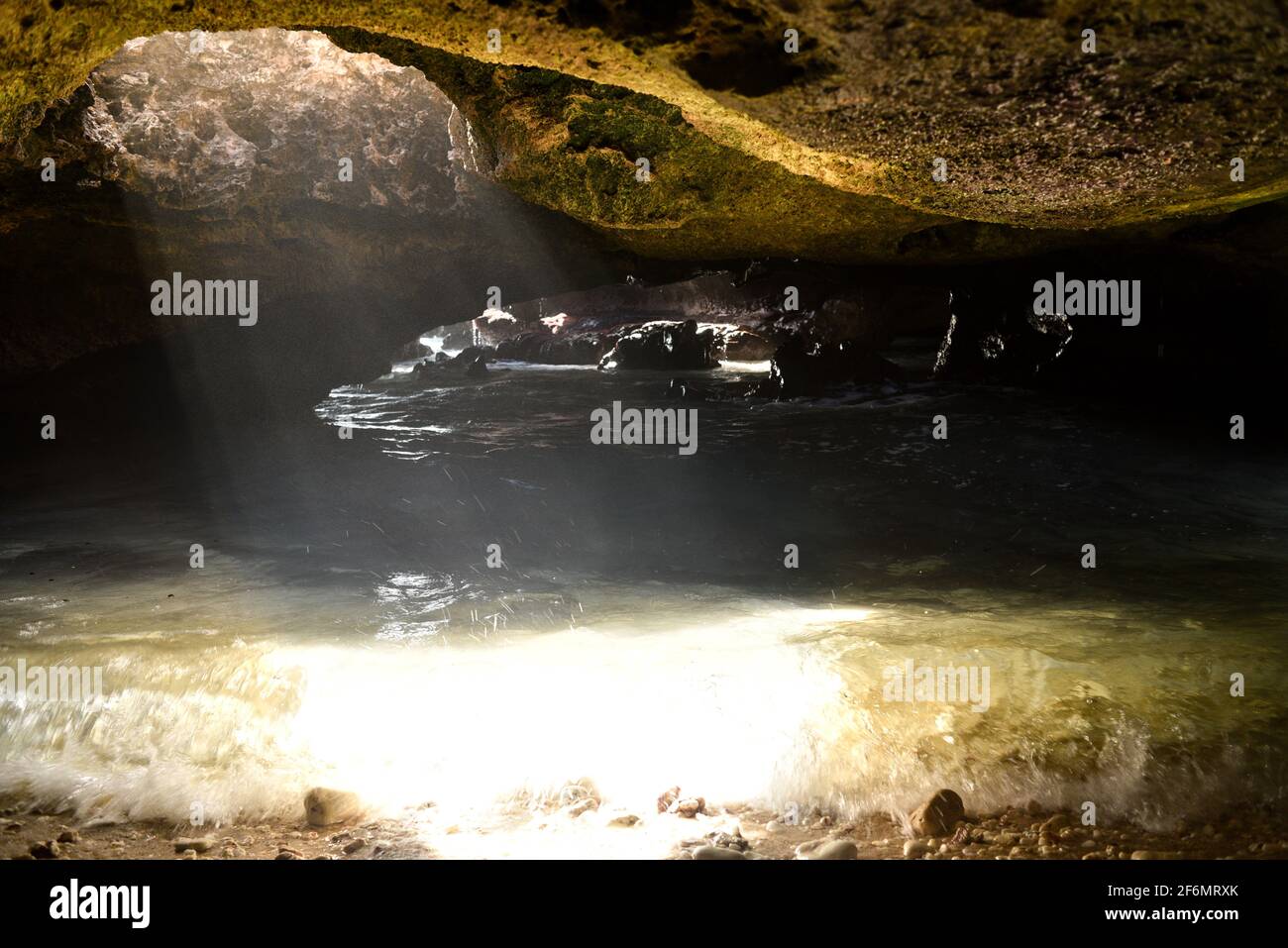 Spectacular Mermaid Caves with sunlight piercing through hole in ...