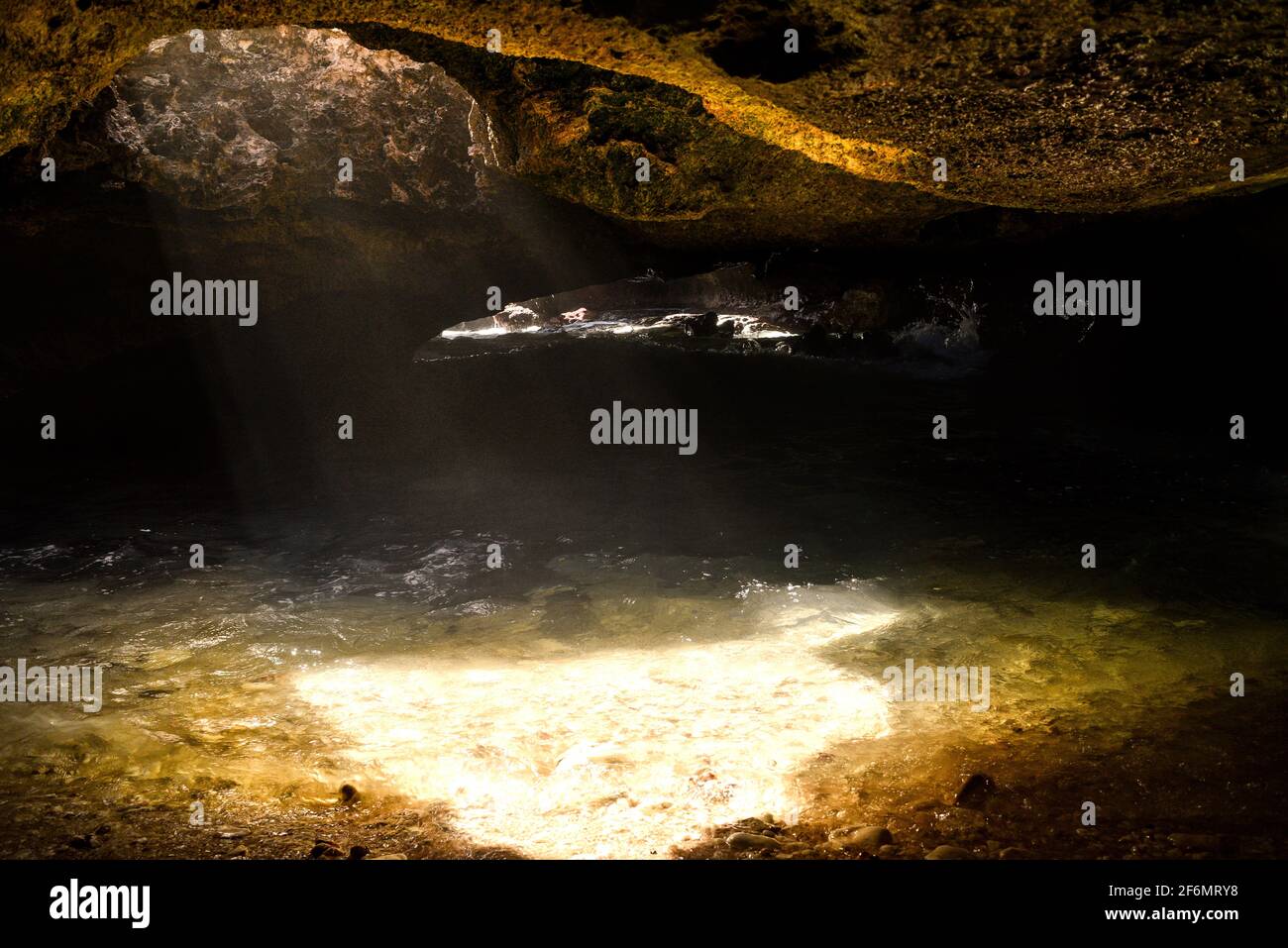 Spectacular Mermaid Caves with sunlight piercing through hole in ...