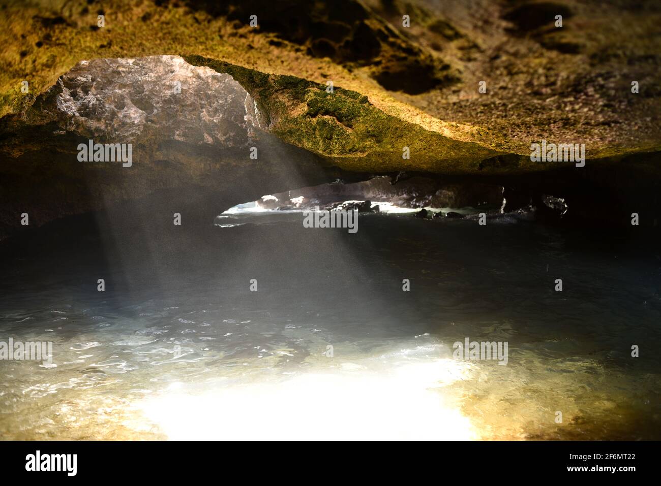 Spectacular Mermaid Caves with sunlight piercing through hole in ...