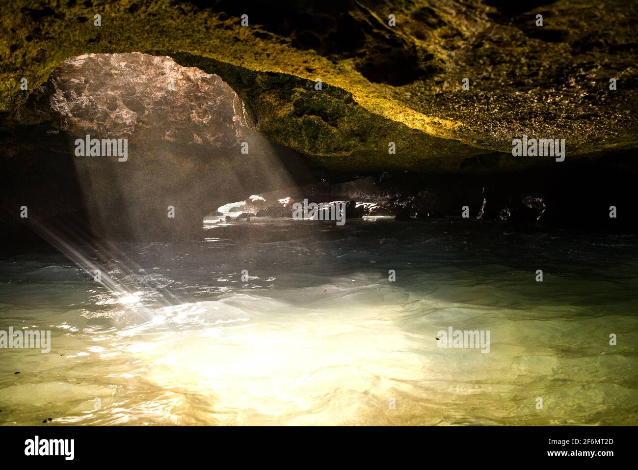Spectacular Mermaid Caves with sunlight piercing through hole in ...