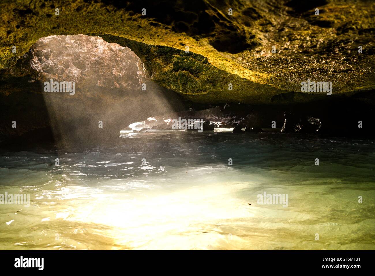 Spectacular Mermaid Caves with sunlight piercing through hole in ...
