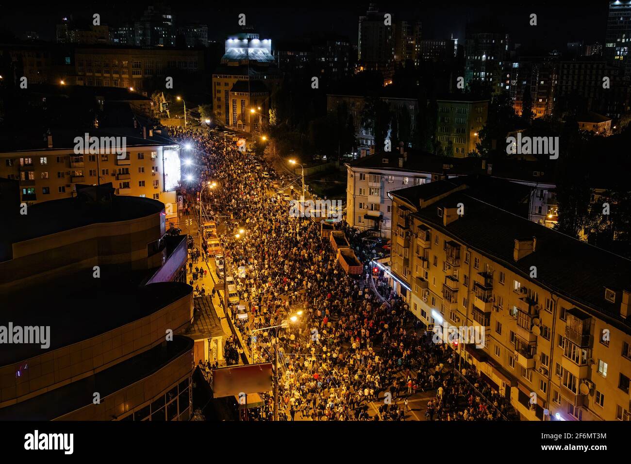 Aerial view of crowd of people walking along the street Stock Photo - Alamy