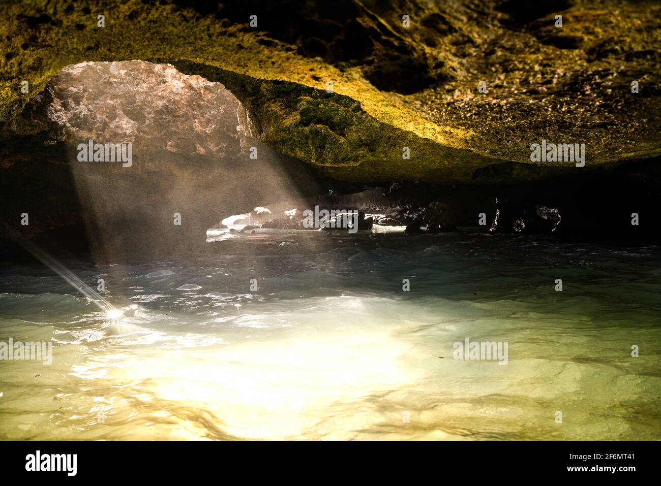 Spectacular Mermaid Caves with sunlight piercing through hole in ...