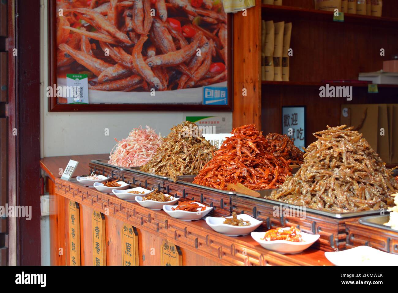 Fried fish snacks for sale in a Chinese street food shop. These small ...