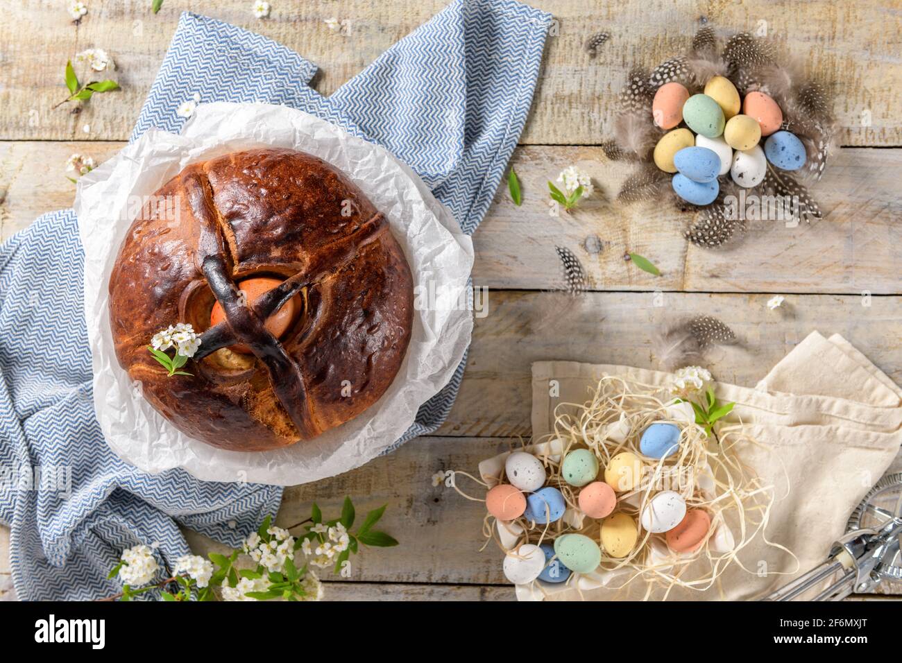 Portuguese traditional Easter cake. Folar with eggs on easter table ...