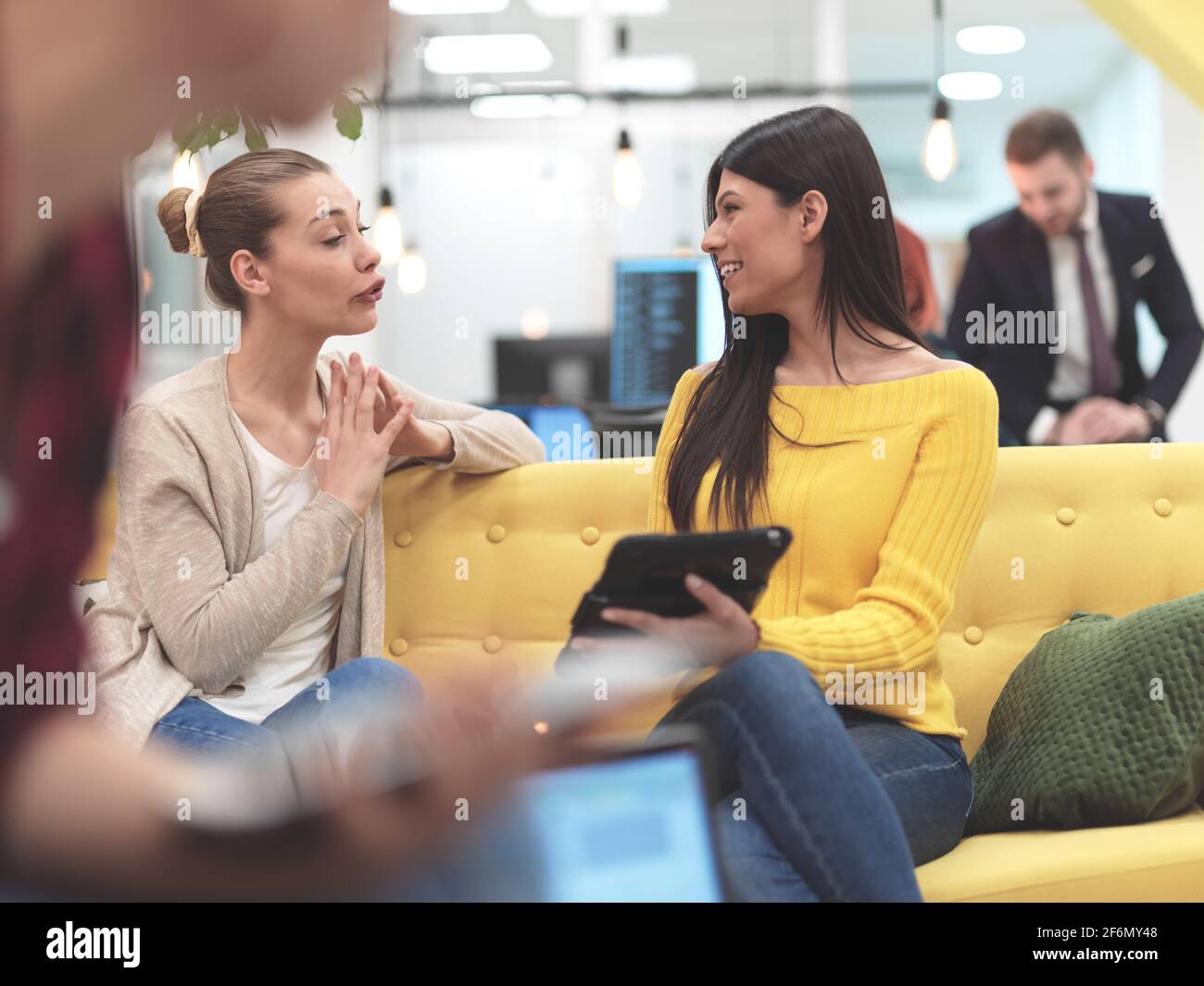 female friends discussion about project at moder coworking office Stock ...