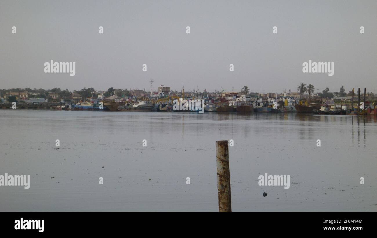 basra, Iraq - april 27, 2018: photo of boat in the river in basra city ...