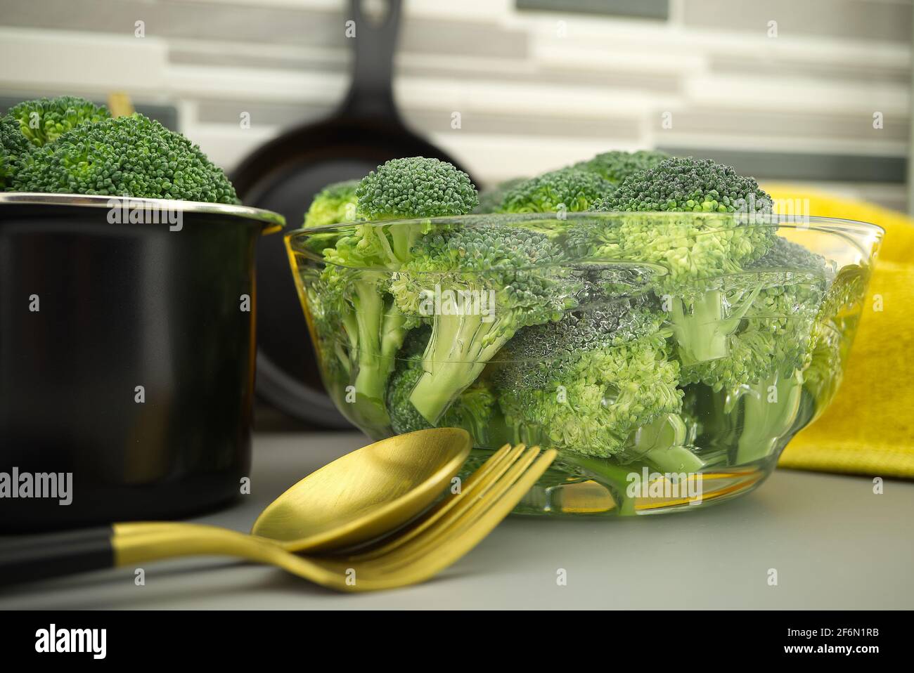 Broccoli preparation for cooking on the kitchen table, broccoli florets ...