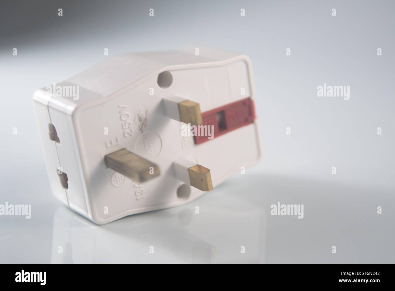 Close up of an electrical three way plug adapter Stock Photo - Alamy