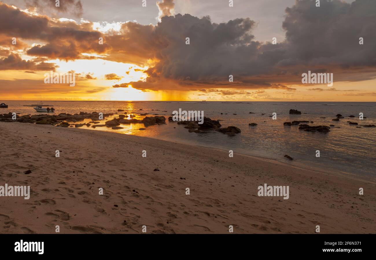 Sunset on the beach Stock Photo - Alamy