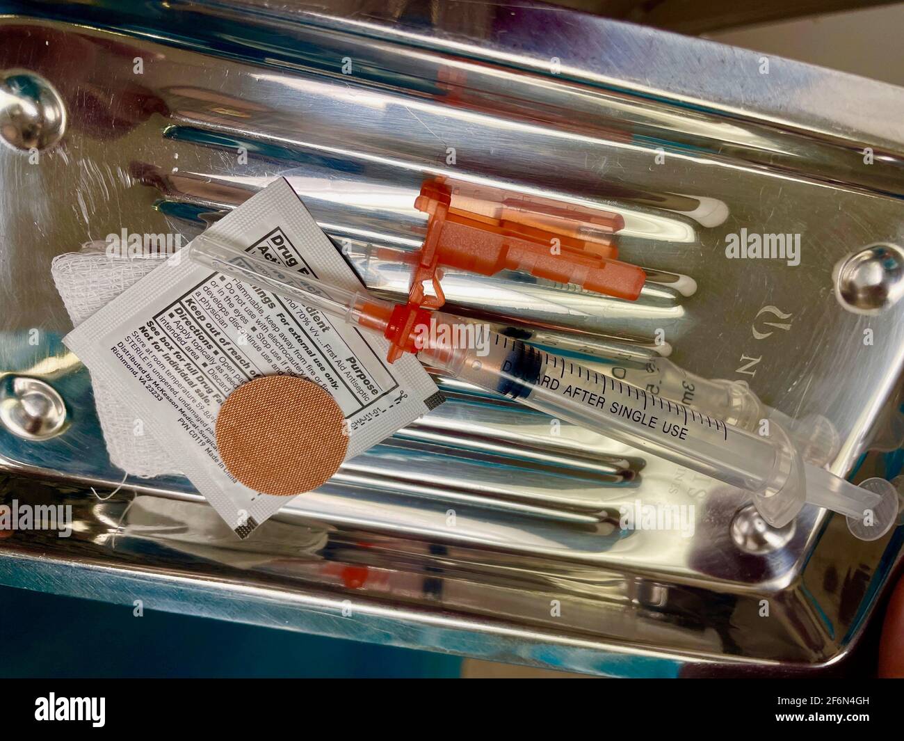 Santa Barbara, CA, USA. 1st Apr, 2021. Covid-19 Vaccine Syringe, band ...