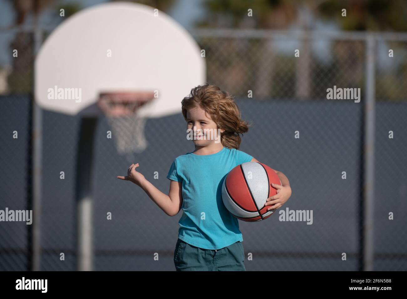 Cute child playing basketball. Active kids lifestyle. Little child boy ...
