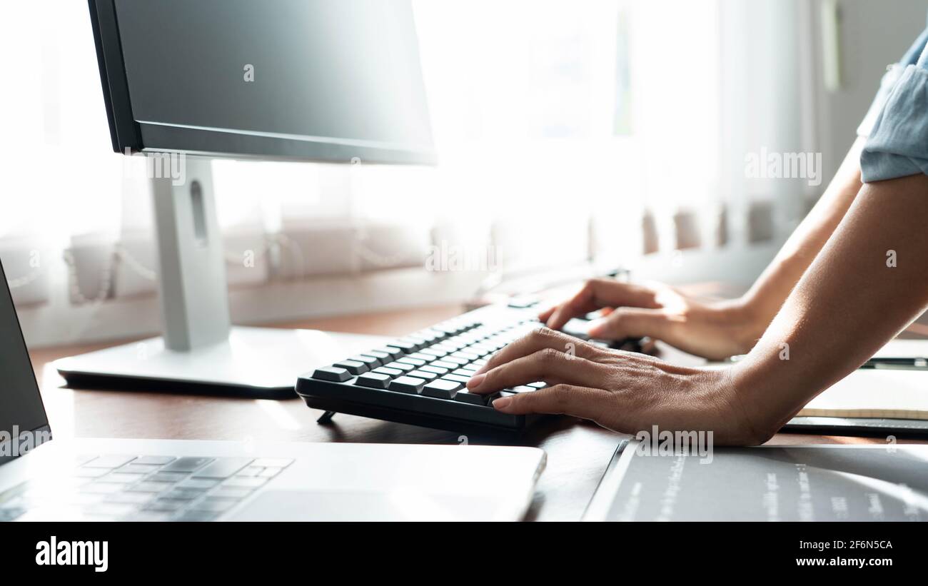 Software developer or programmer working data debugging improvement binary algorithm on desktop ...