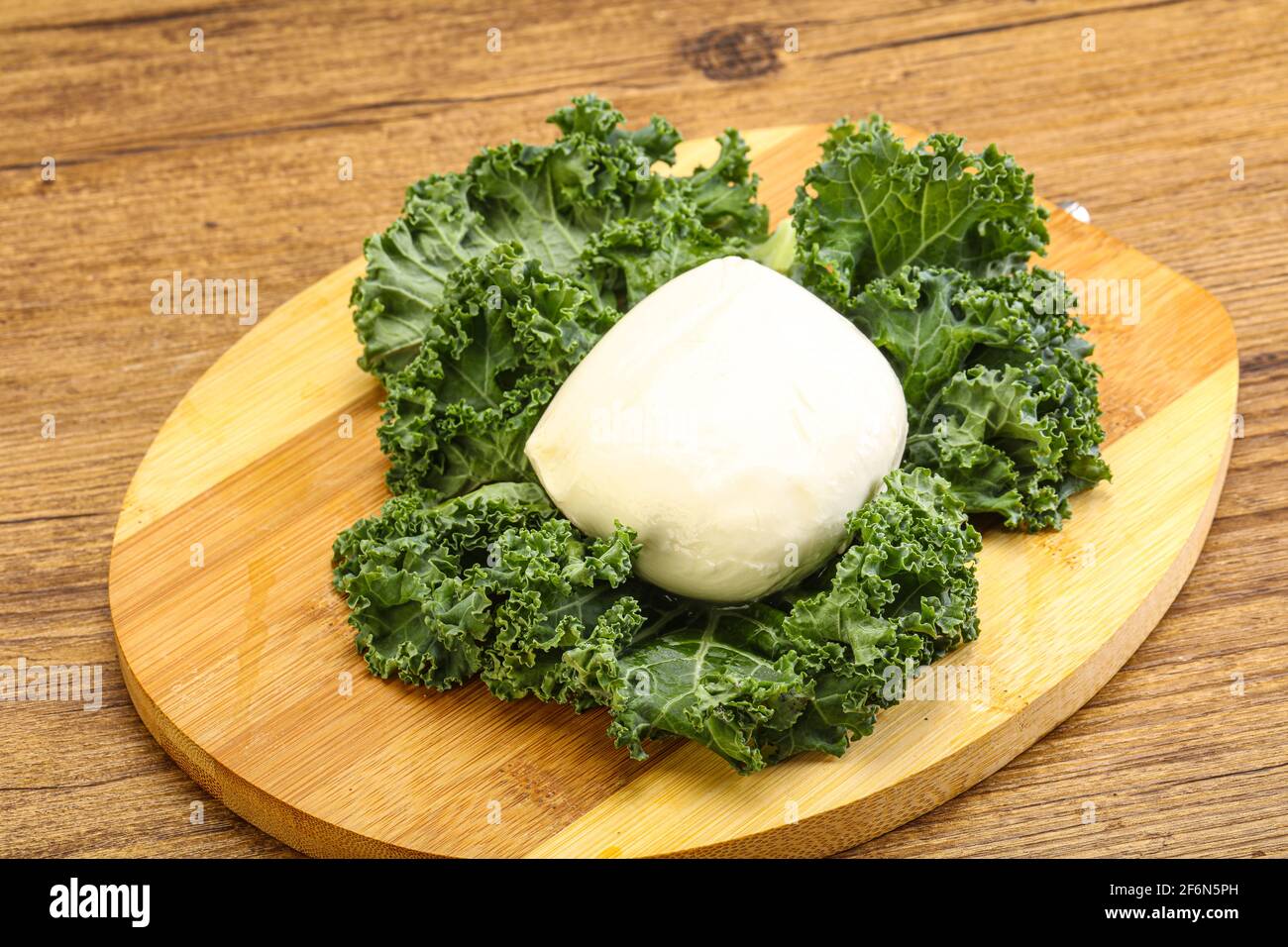 Soft Italian mozzarella cheese over board Stock Photo - Alamy