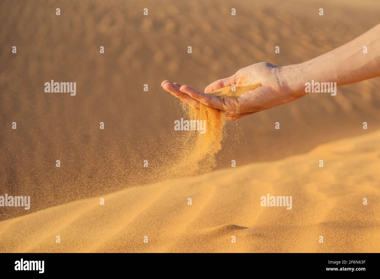 Sand running through fingers hi-res stock photography and images - Alamy