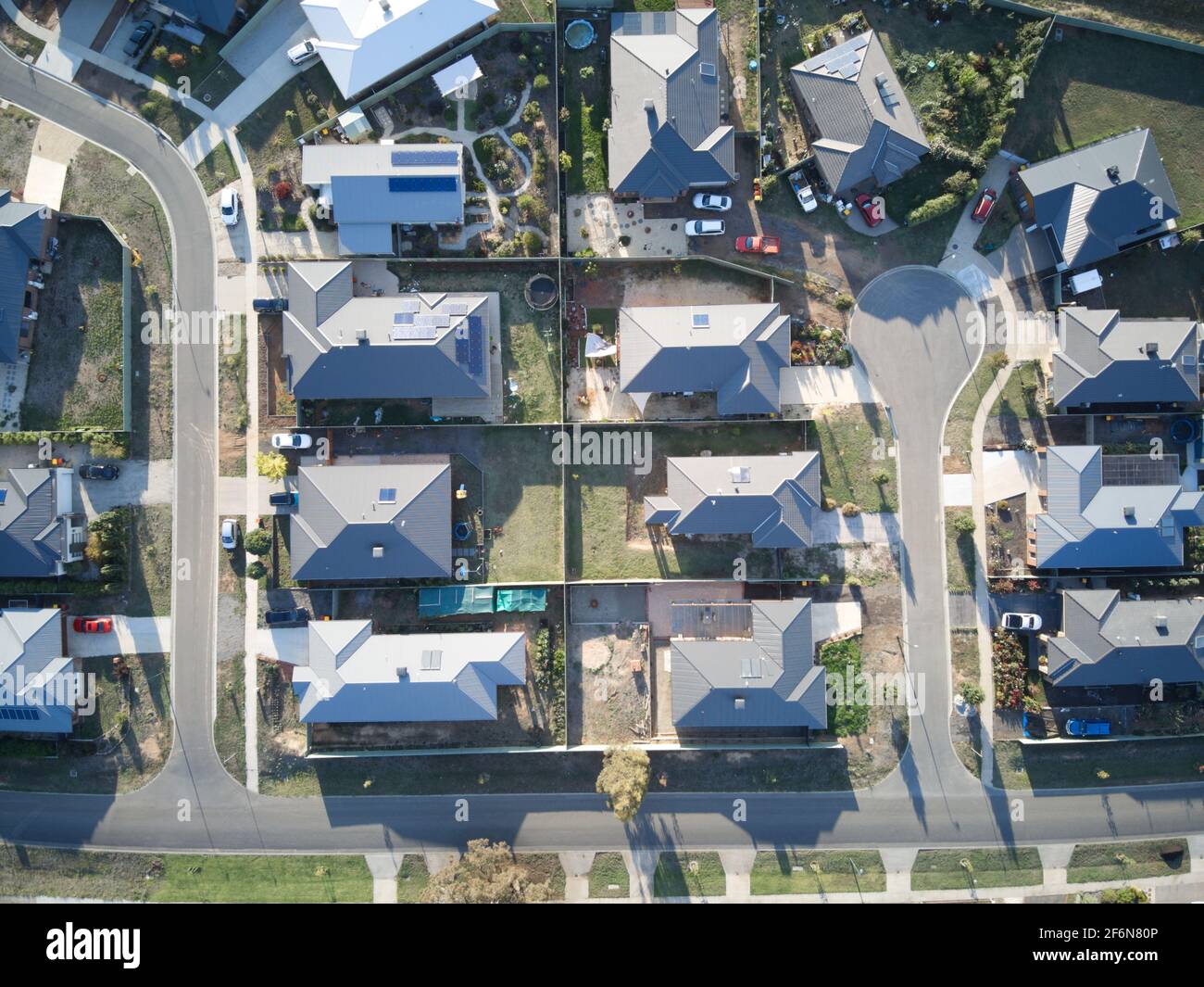 Aerial Australia urban street scene with houses, vehicles and yards ...
