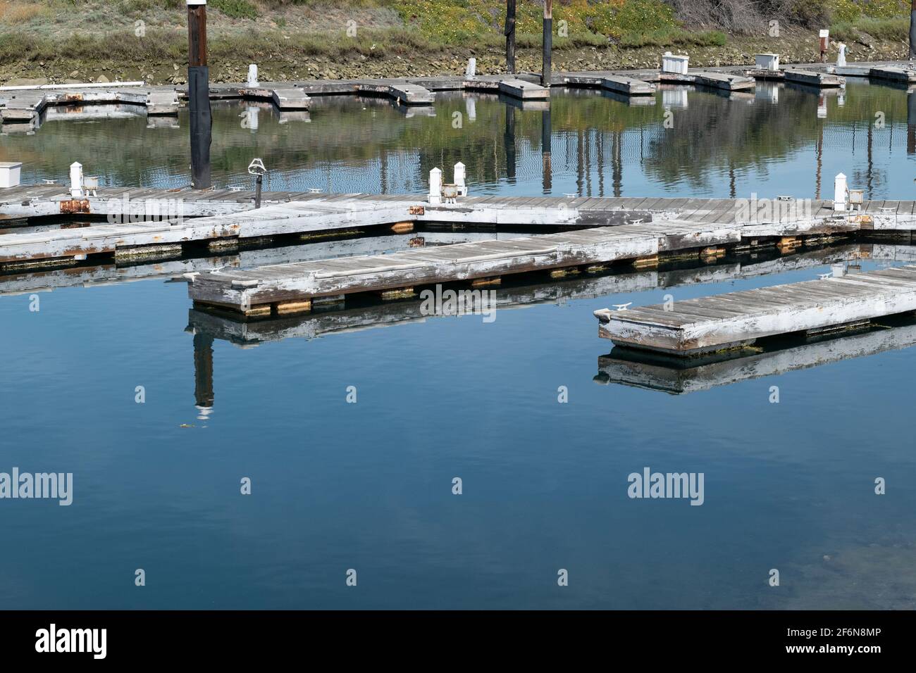 Old distressed or rotting wooden docks that have been abandoned in the ...