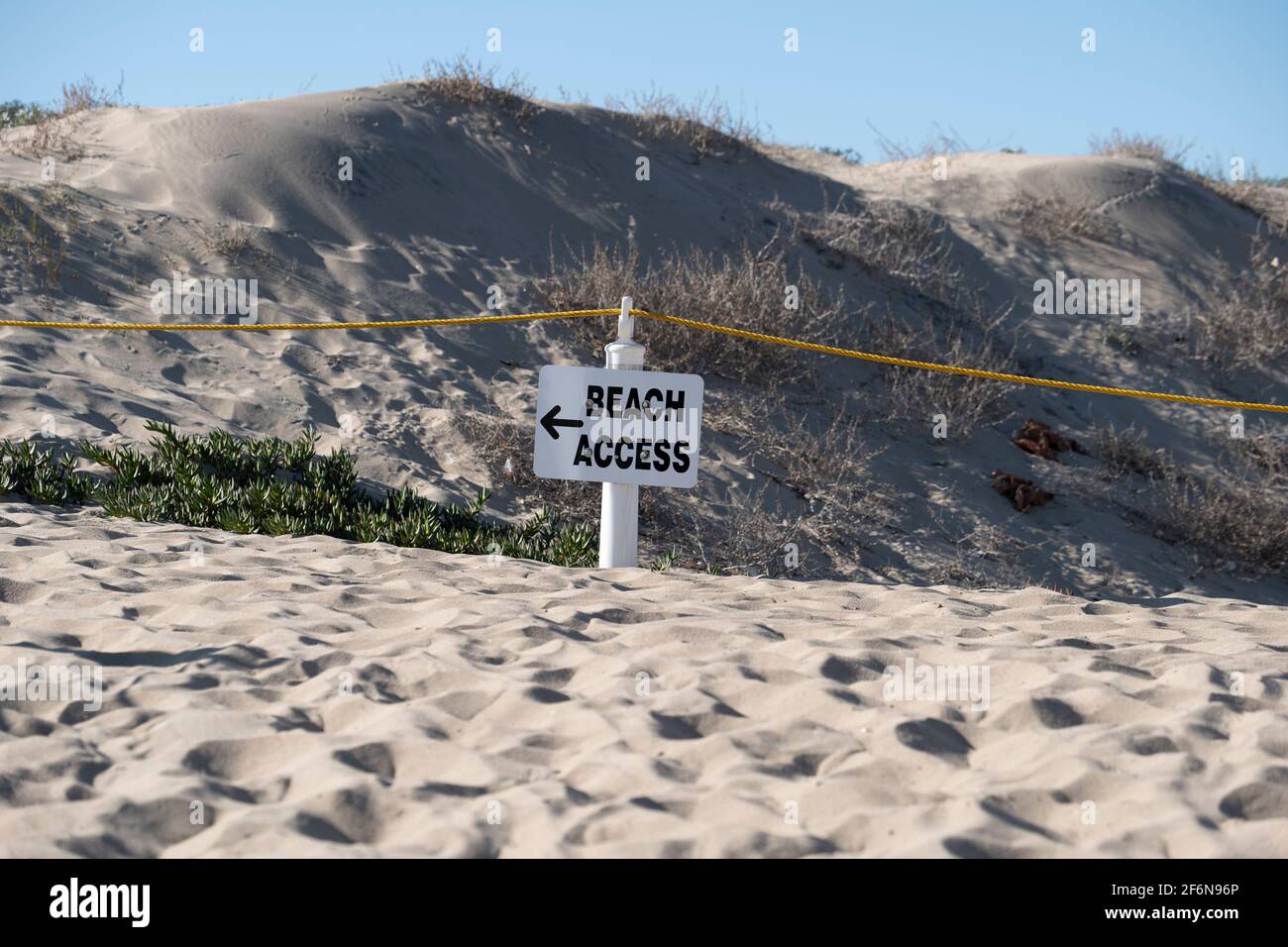 Beach Access sign on a sandy path to a beach in the summer Stock Photo ...