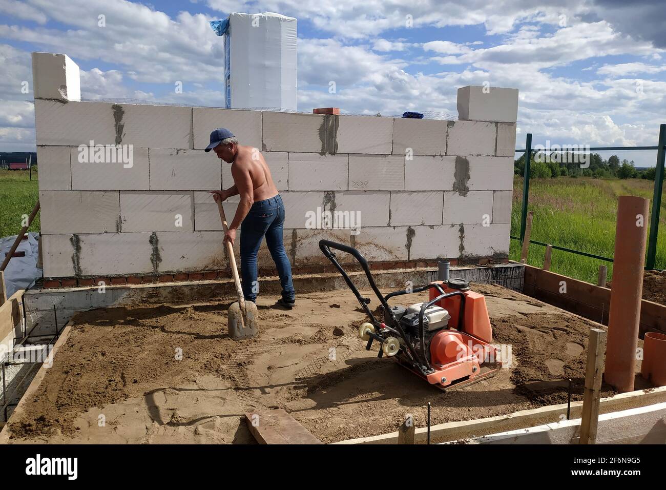 Construction work on the construction site, soil compaction with a ...