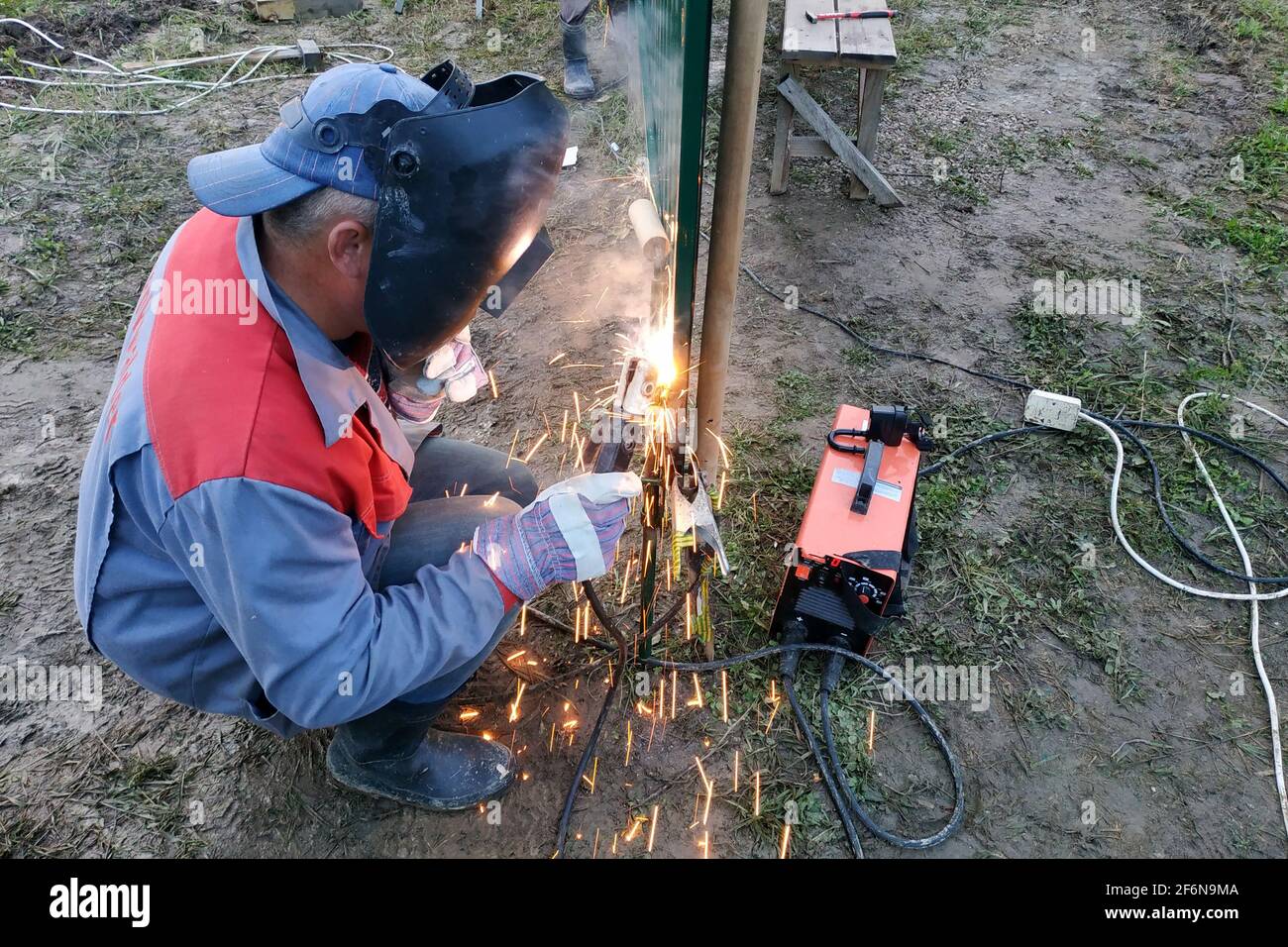 welding of a metal profile to a fence, process of welding close-up, the ...