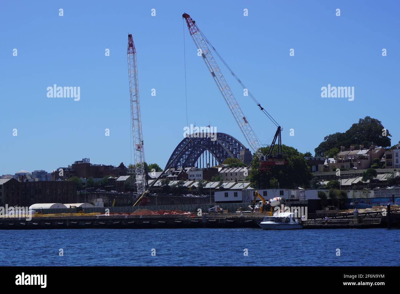 Sydney Harbour Bridge Arch rising between two Construction Cranes Stock ...