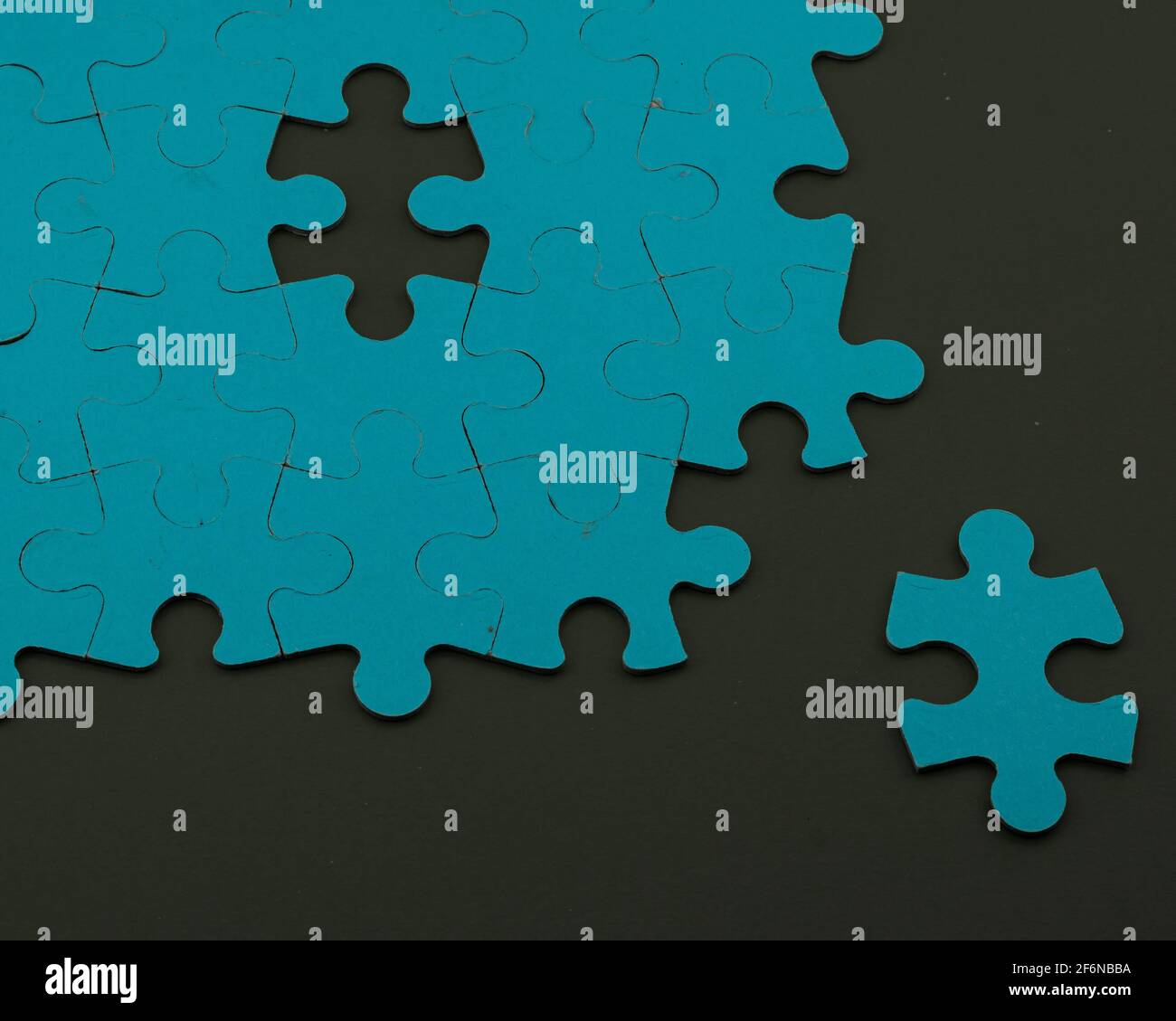 incomplete puzzle with isolated piece Stock Photo - Alamy