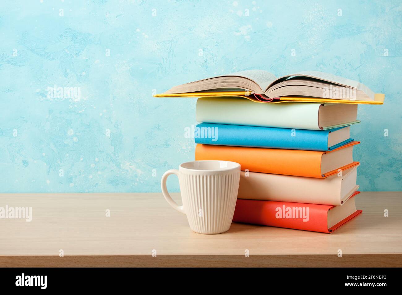 Opened book on top of stack of books hi-res stock photography and ...