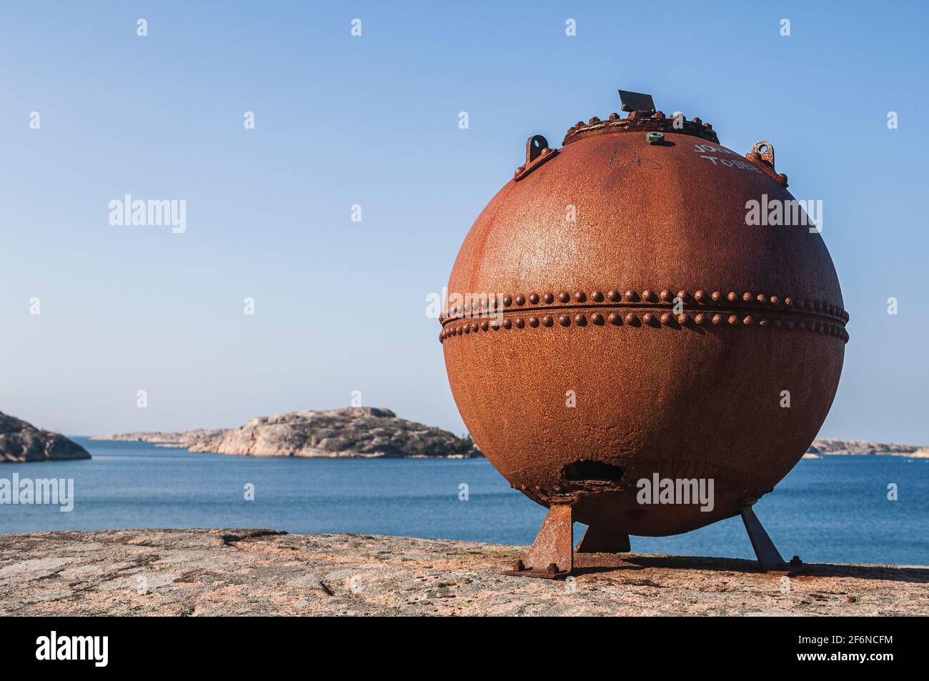 Old rusty sea mine standing on cliff Stock Photo - Alamy