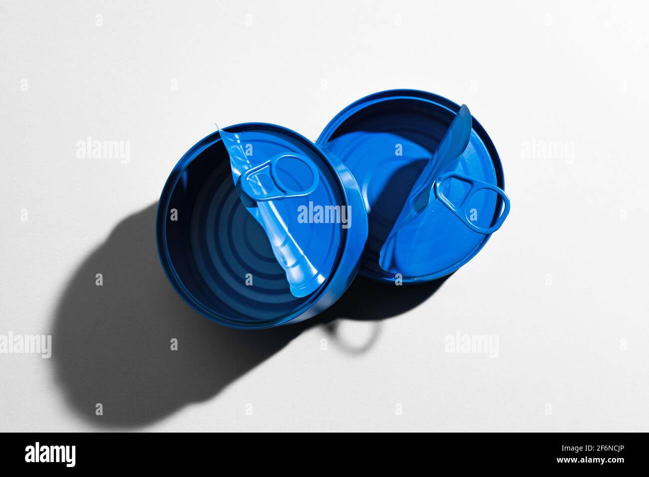 Painted blue opened tin can with ring on white background Stock Photo ...