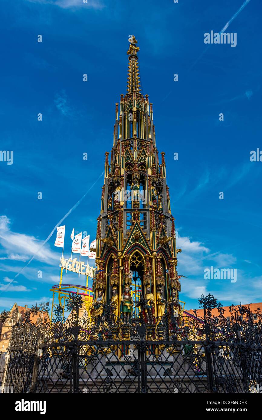 Beautiful golden tower monument in the market square of Nuremberg ...