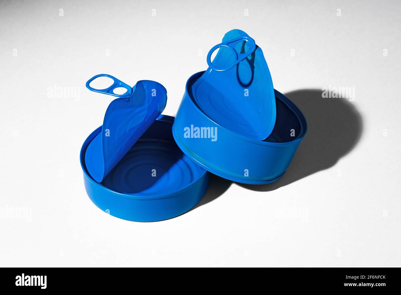Painted blue opened tin can with ring on white background Stock Photo ...