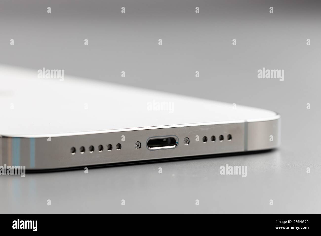 Close up of charging port of modern smartphone on gray background Stock ...