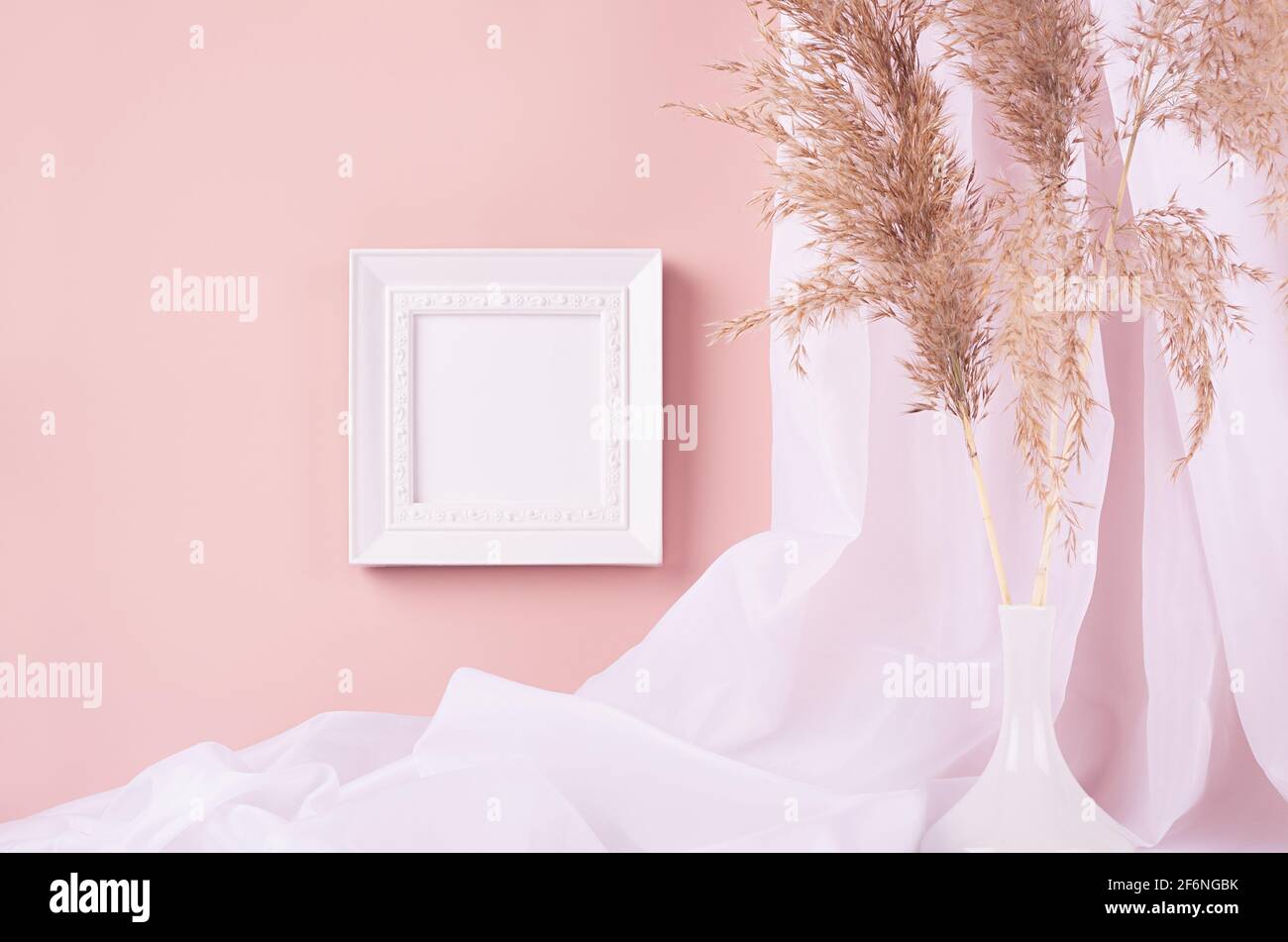 Elegant home decoration - square blank photo frame hanging on pink wall ...