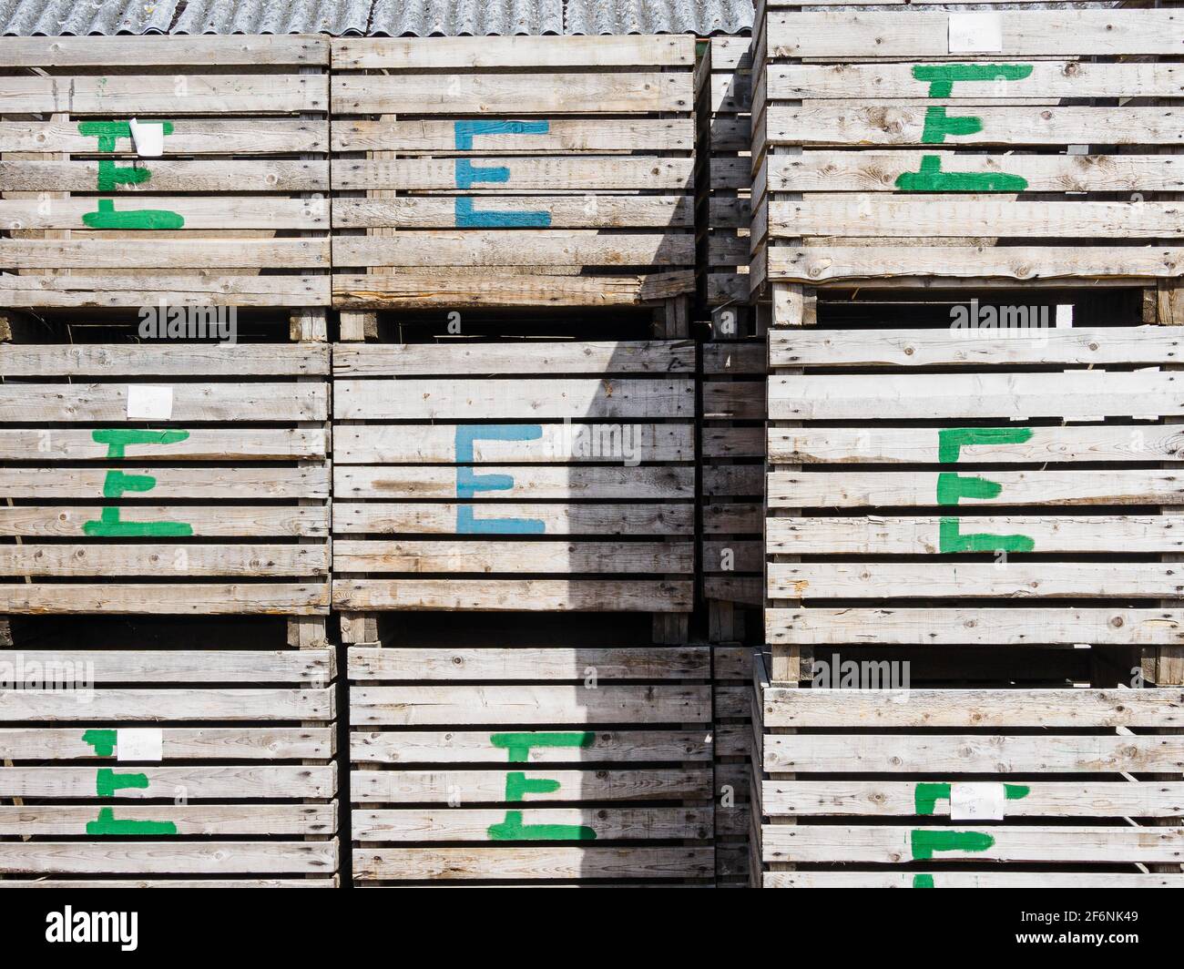 Wooden boxes marked with letter E Stock Photo - Alamy