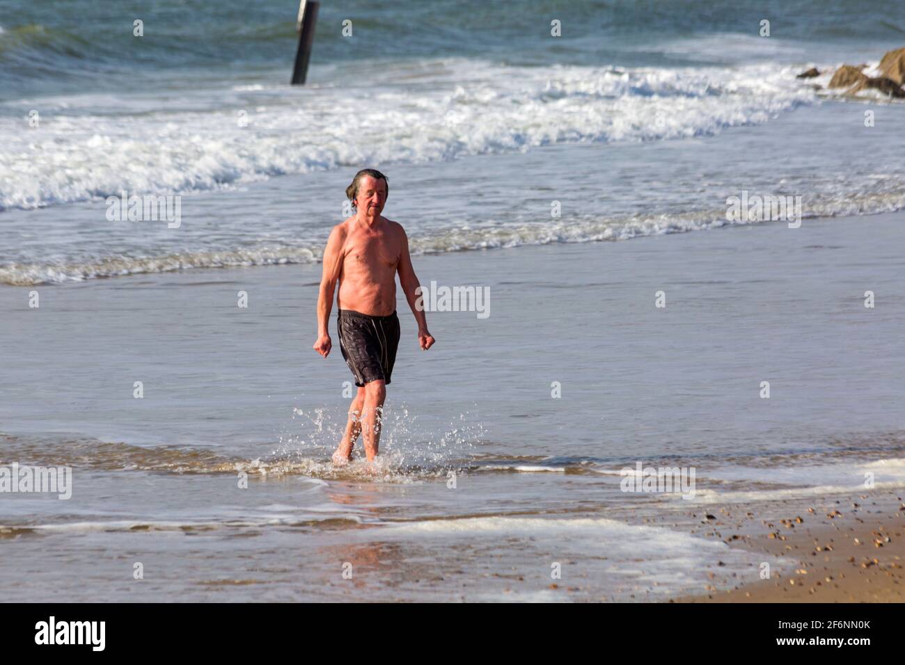 Swimmer walking out of the sea hi-res stock photography and images - Alamy
