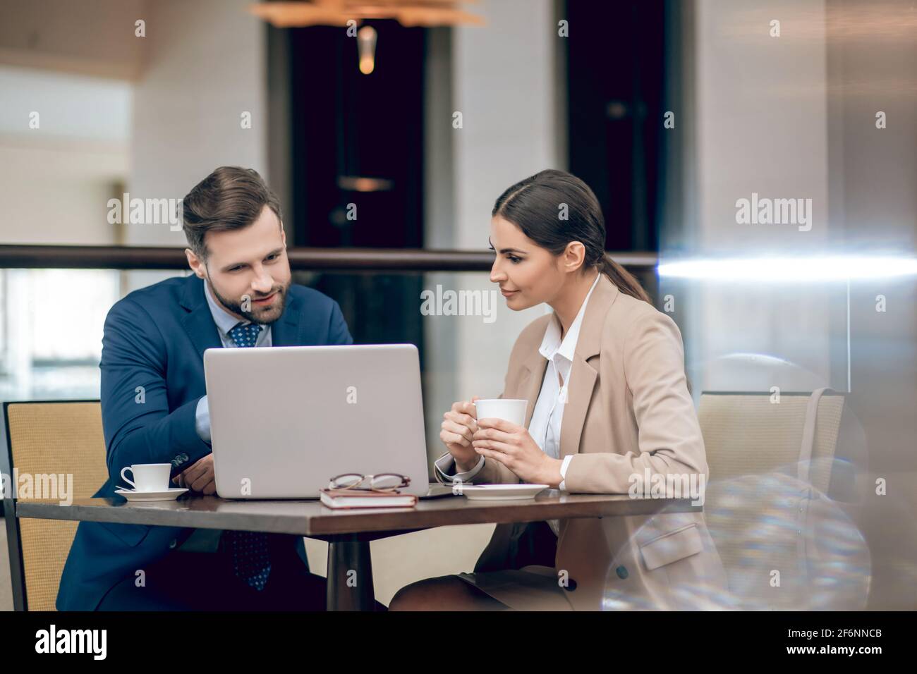 Project discussion. Business partners sitting at the table and ...