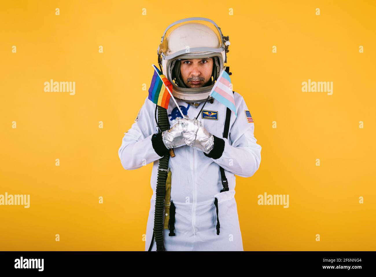 Gay transsexual male cosmonaut with serious gesture in space suit and ...