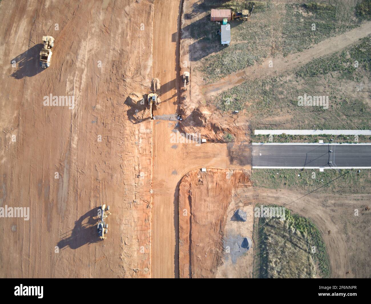 Aerial construction site showing earth moving equipment for a ...